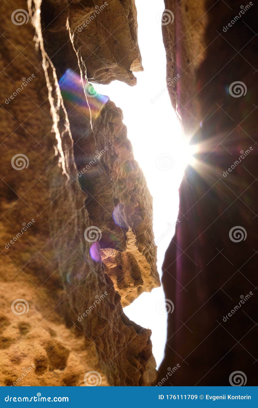 A Small Sandstone Cave Divided by Huge Cracks and Illuminated by the ...
