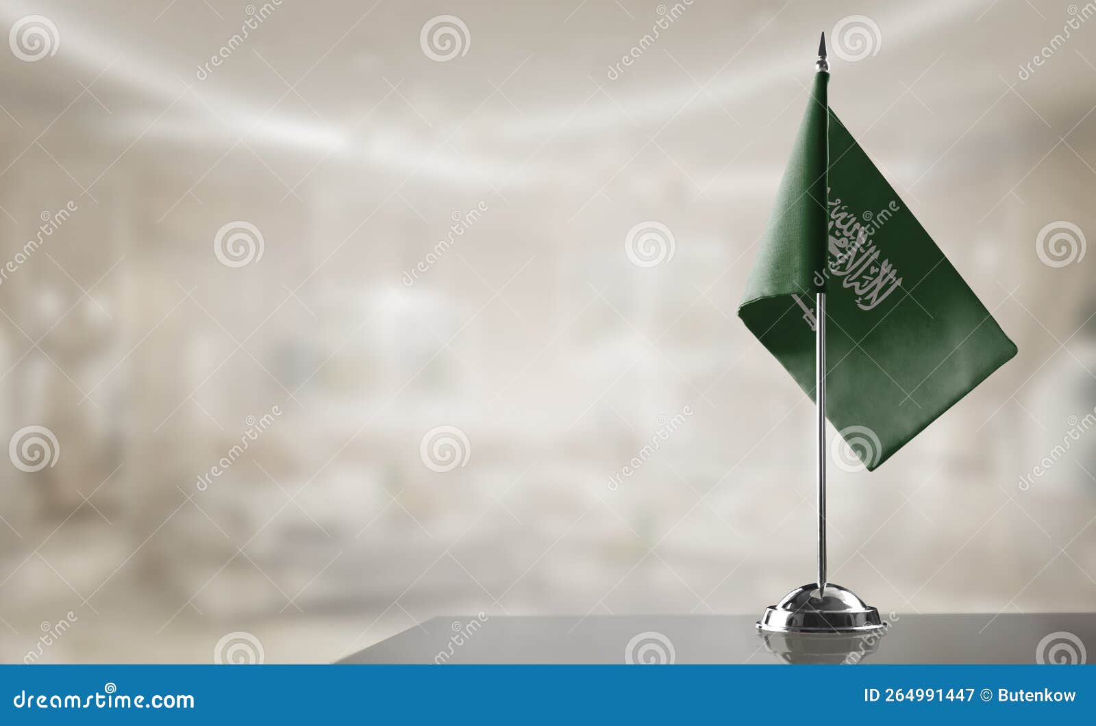 A Small Saudi Arabia Flag on an Abstract Blurry Background Stock Image ...