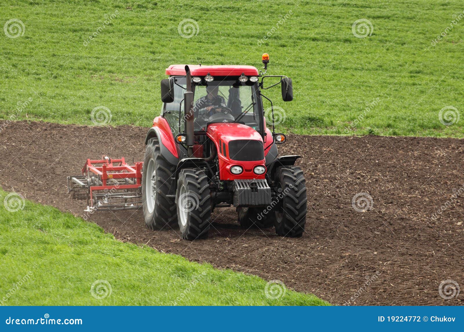 Small Scale Farming with Tractor and Plow in Field Stock Photo - Image ...