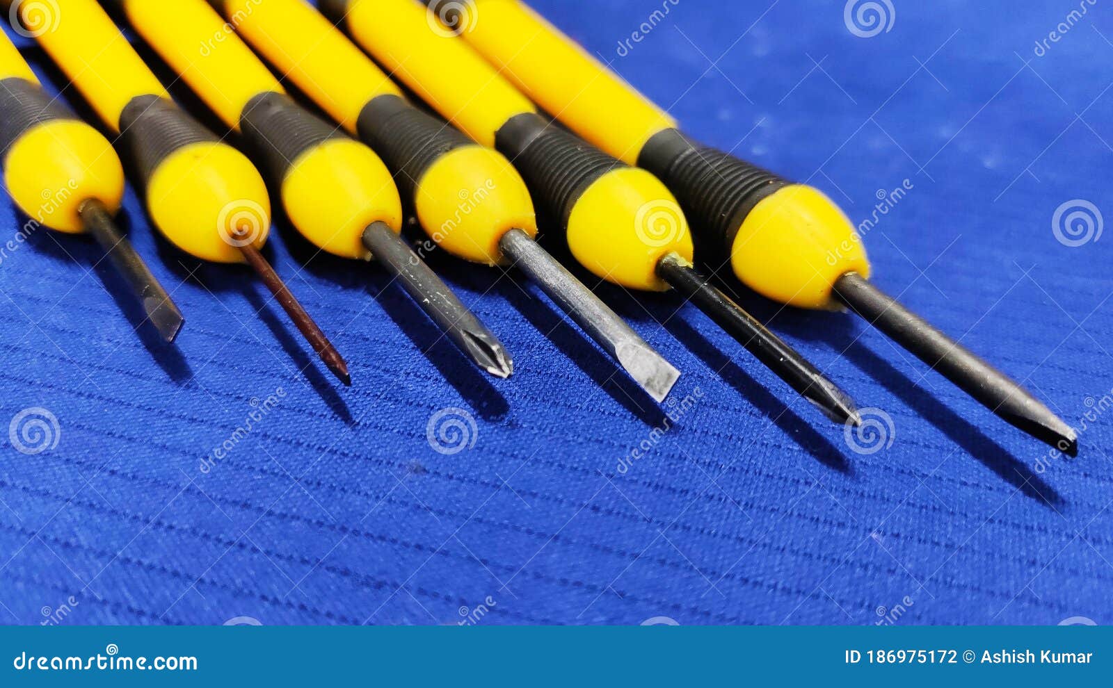 Small Driver Mini Precision Set on Blue Textured Background. Stock ...