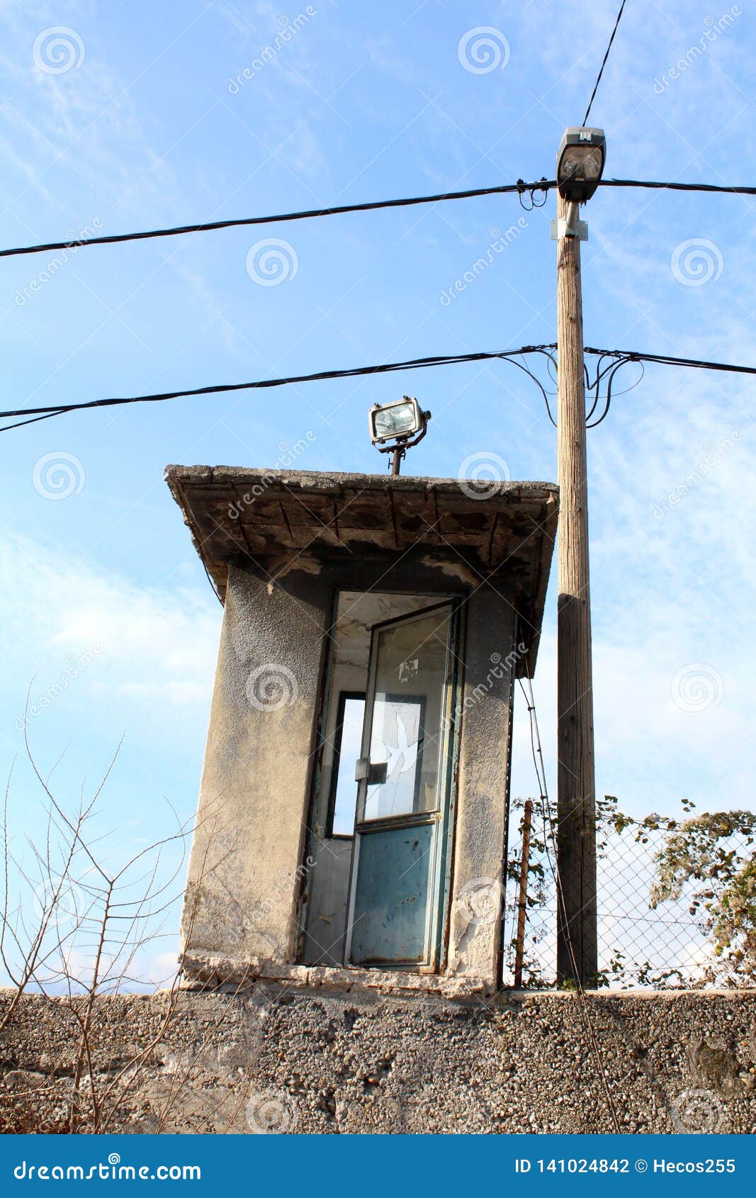 Small Security Guard Structure With Metal Doors And Broken Window Next ...