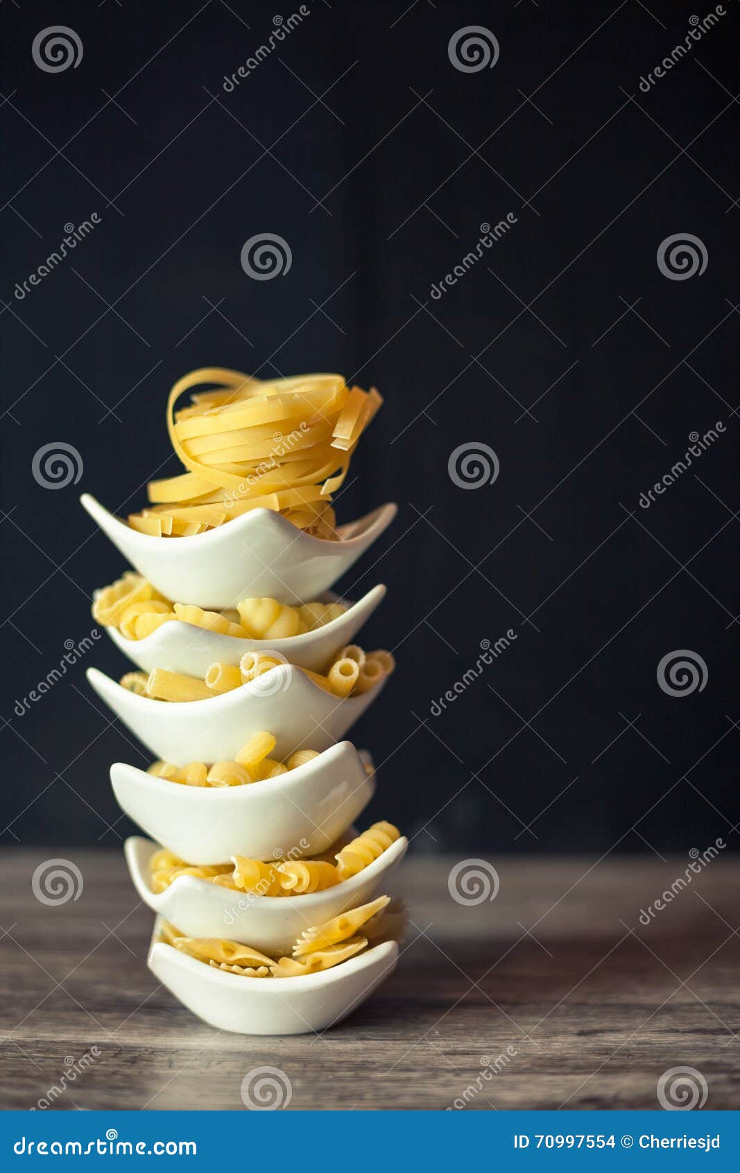 Small Shaped Pasta Arranged in White Bowls Stock Photo - Image of space ...