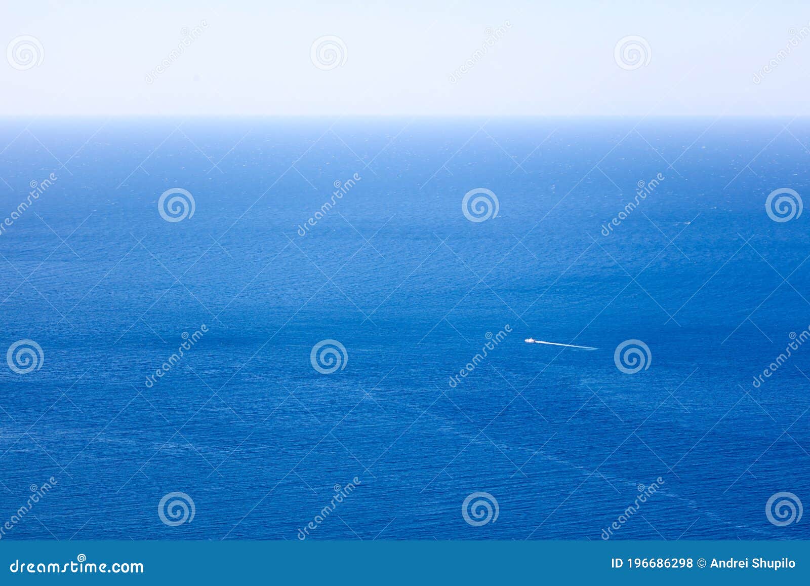 A Small Ship is Sailing in the Blue Ocean Stock Photo - Image of ...