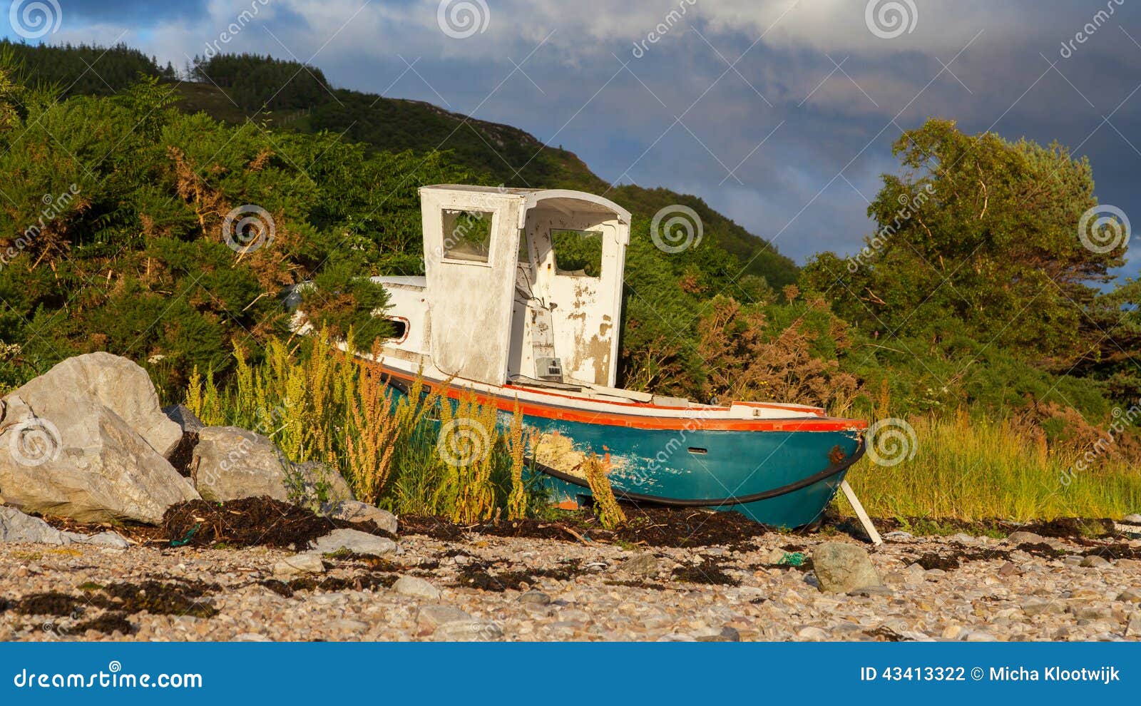 Small Shipwreck at a Loch with Stone Beach Stock Photo - Image of sink ...