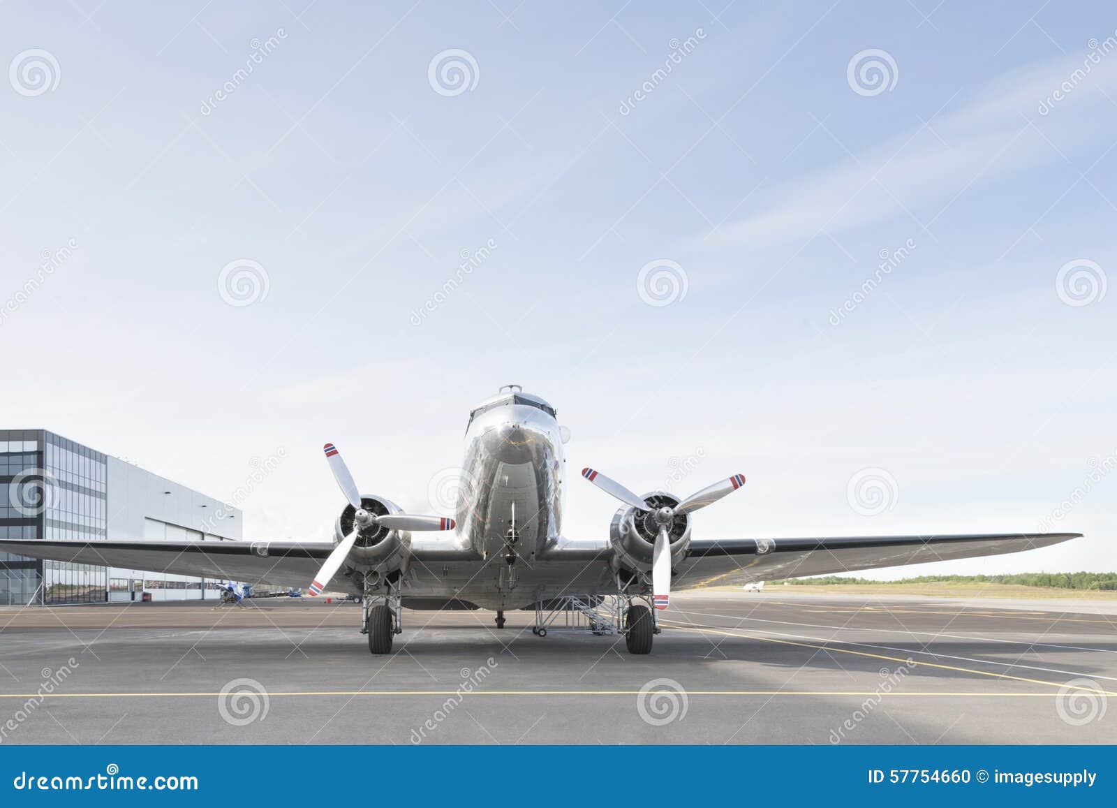 Small Silver Airplane Parked in an Airport Stock Photo - Image of park ...