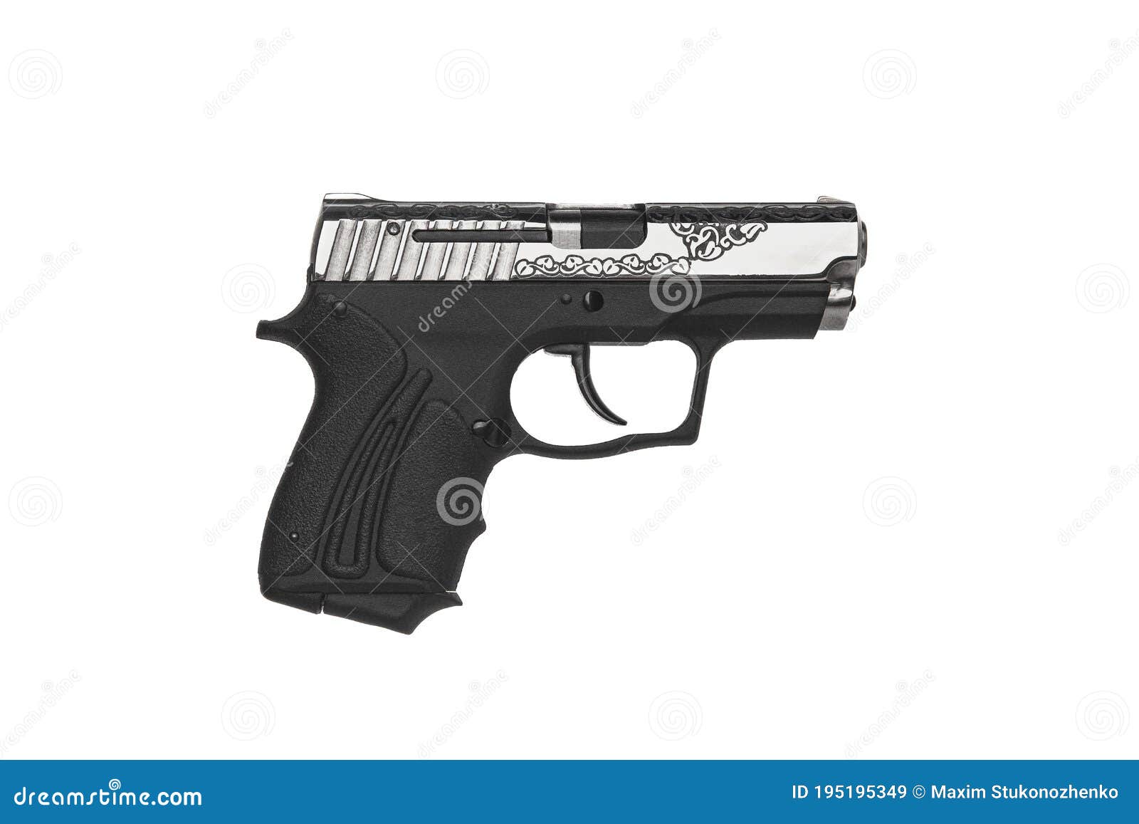 A Small Silver-black Pistol with a Pattern on the Body. Gift Weapon ...