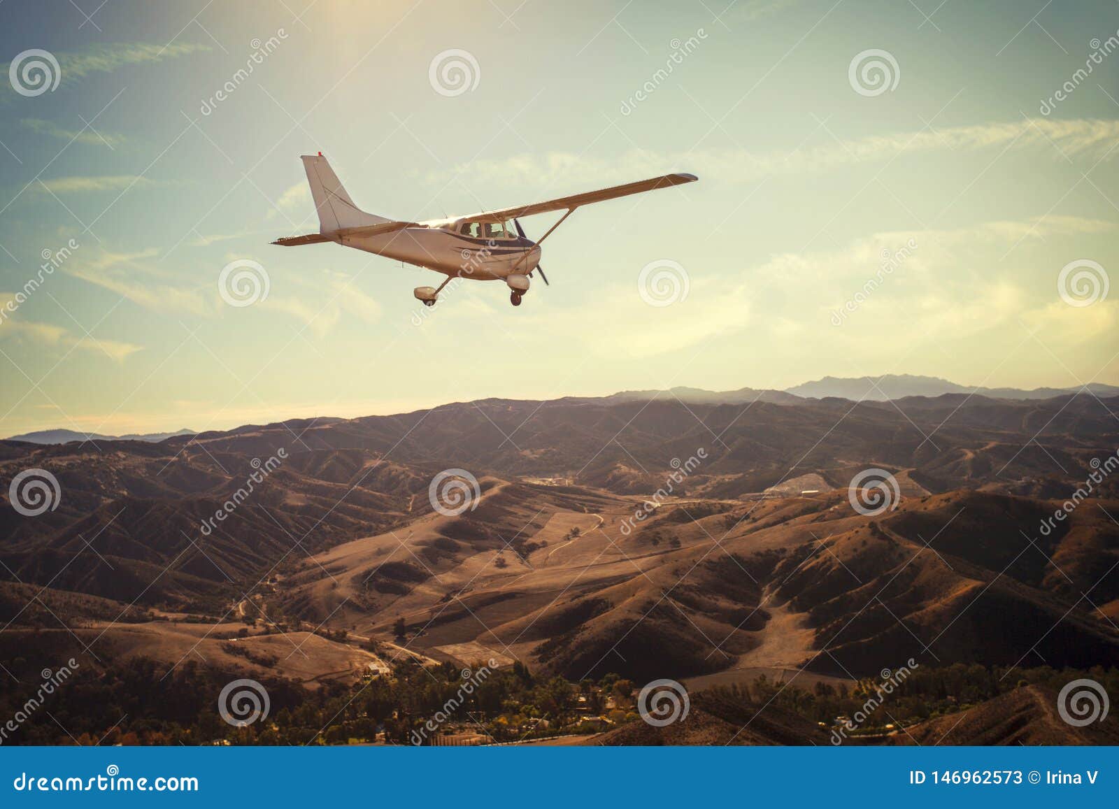 Small Single Engine Airplane Flying in the Gorgeous Sunset Sky Above ...