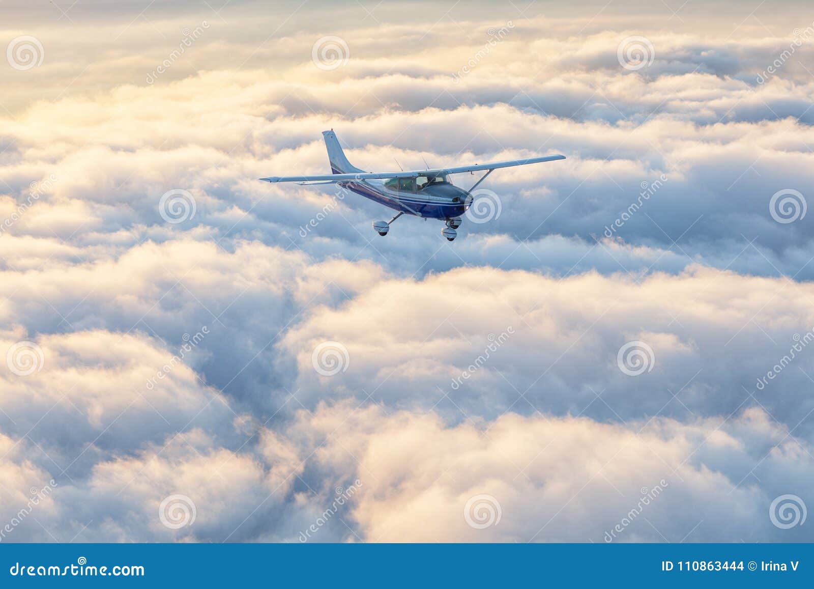 Small Single Engine Airplane Flying in the Gorgeous Sunset Sky Stock ...
