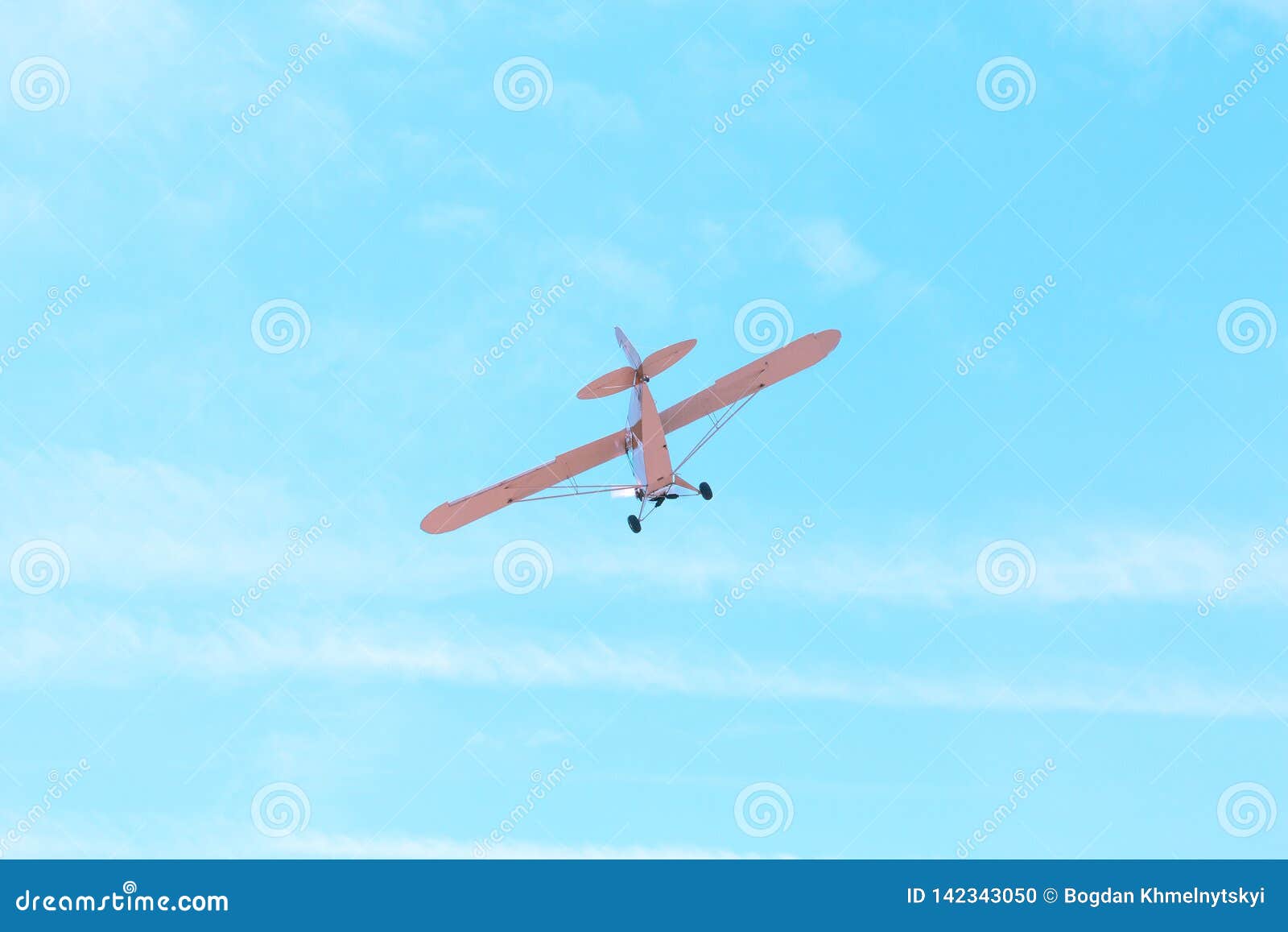 Small Single-engine Old Vintage Plane Flying Against the Blue Sky Stock ...