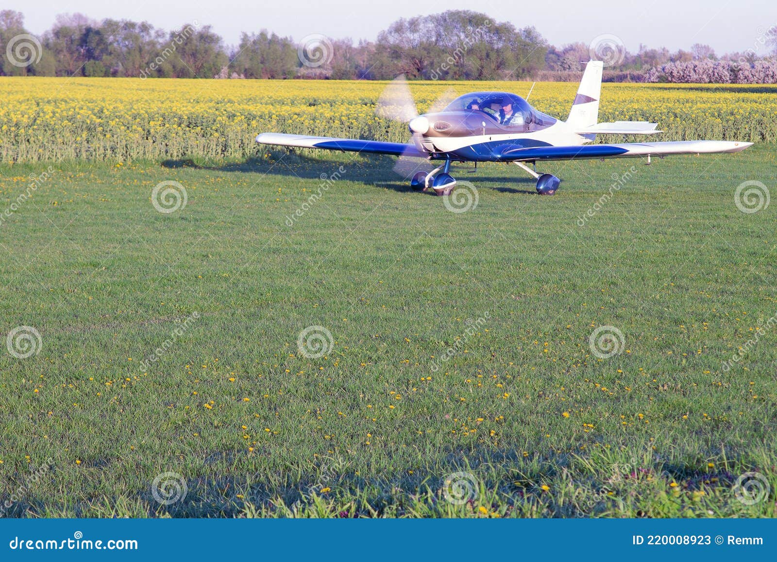A Single-engine Plane Takes Off from the Meadow Stock Image - Image of ...