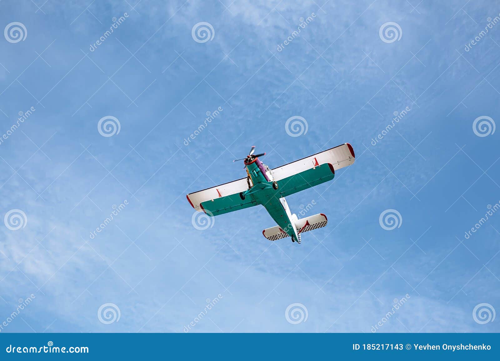 Small Single Engine Vintage Colorful Airplane in a Blue Cloudy Sky ...