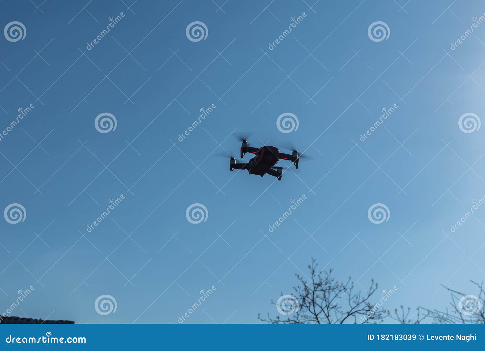 Small Sized Red Drone with High Resolution Camera Hovering in Air for ...