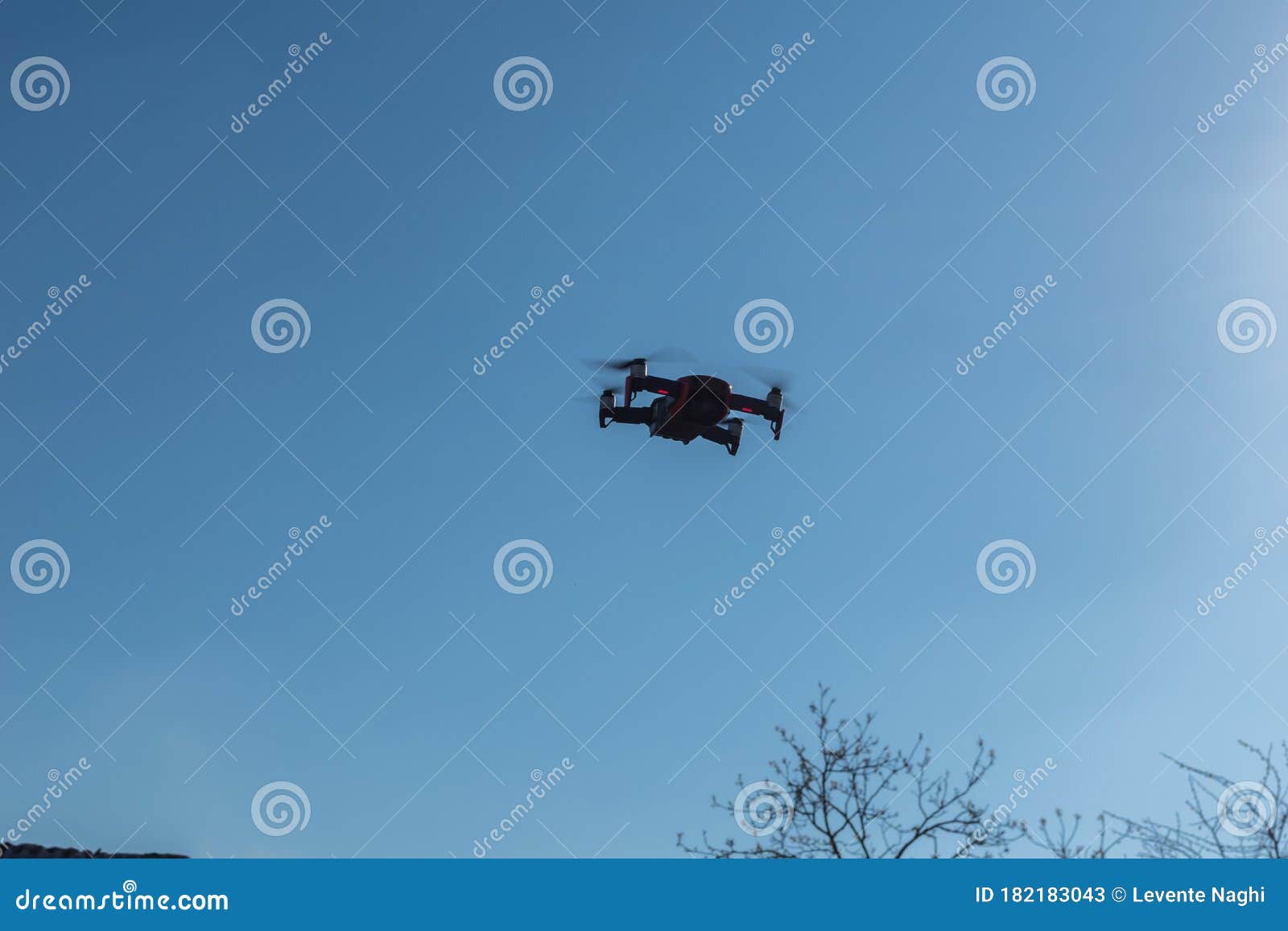 Small Sized Red Drone with High Resolution Camera Hovering in Air for ...