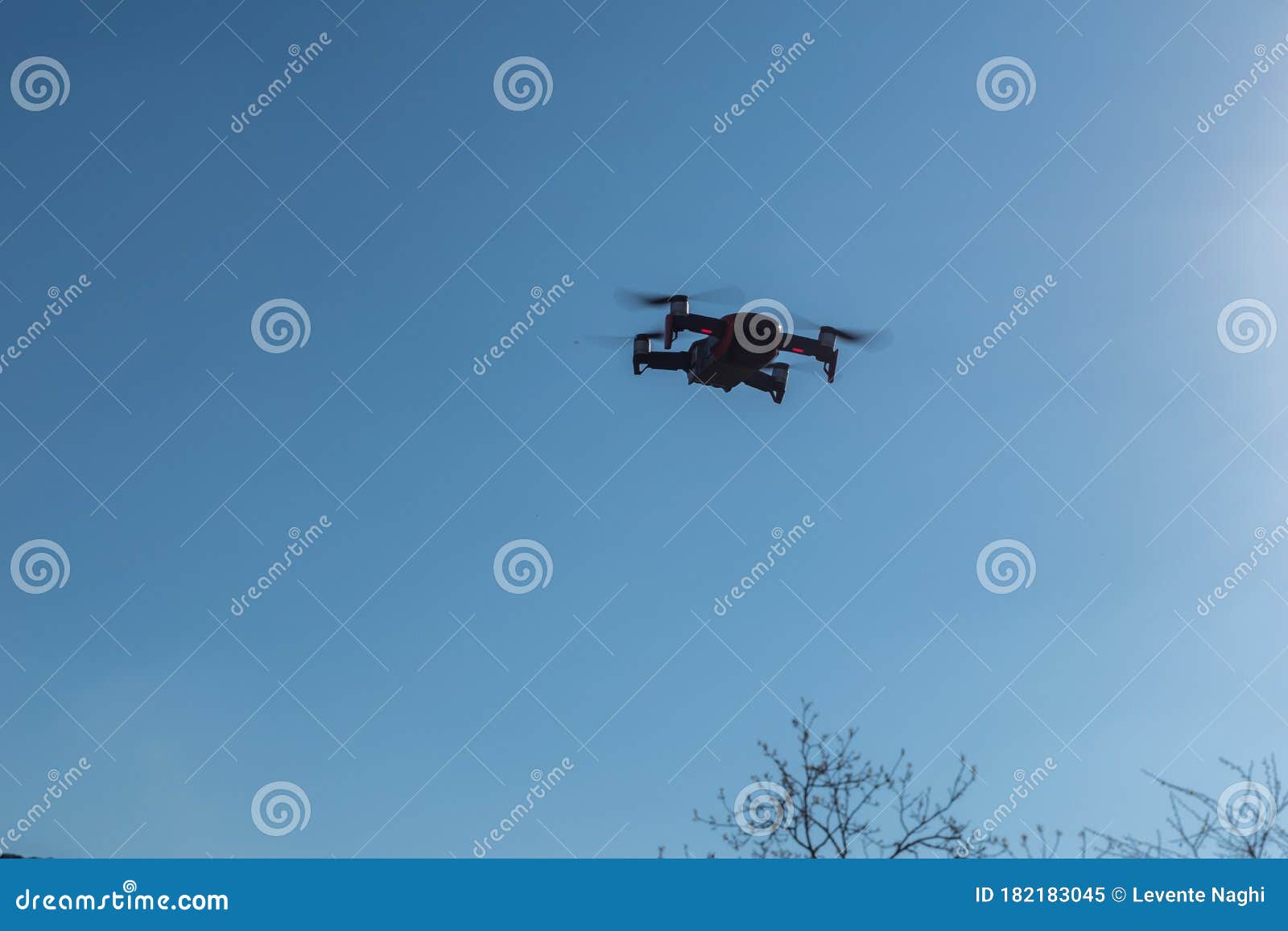Small Sized Red Drone with High Resolution Camera Hovering in Air for ...