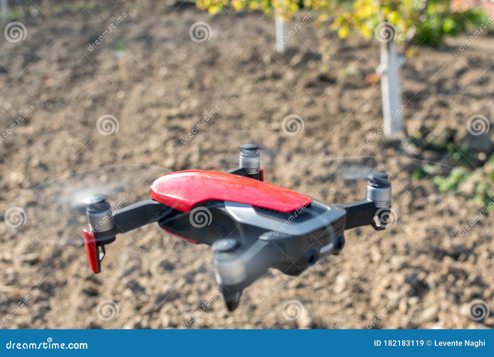 Small Sized Red Drone with High Resolution Camera Hovering in Air for ...