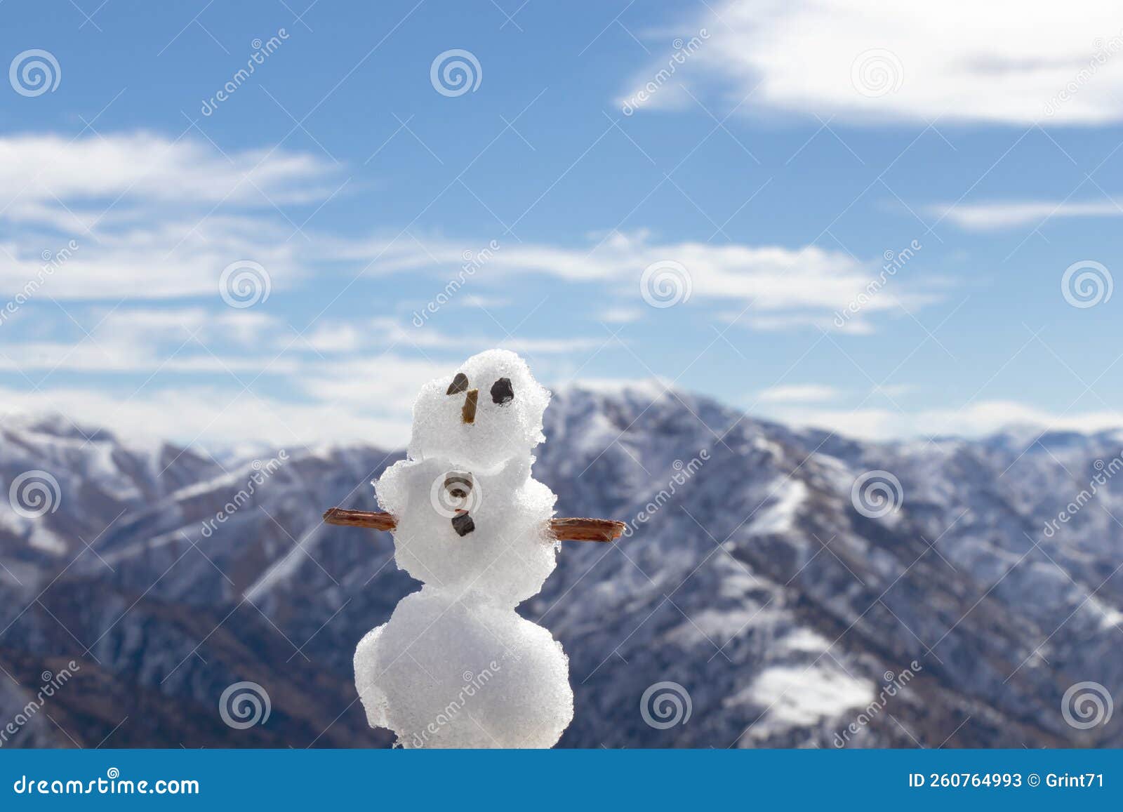A Small Snowman on the Background of Snowy Mountains Stock Image ...