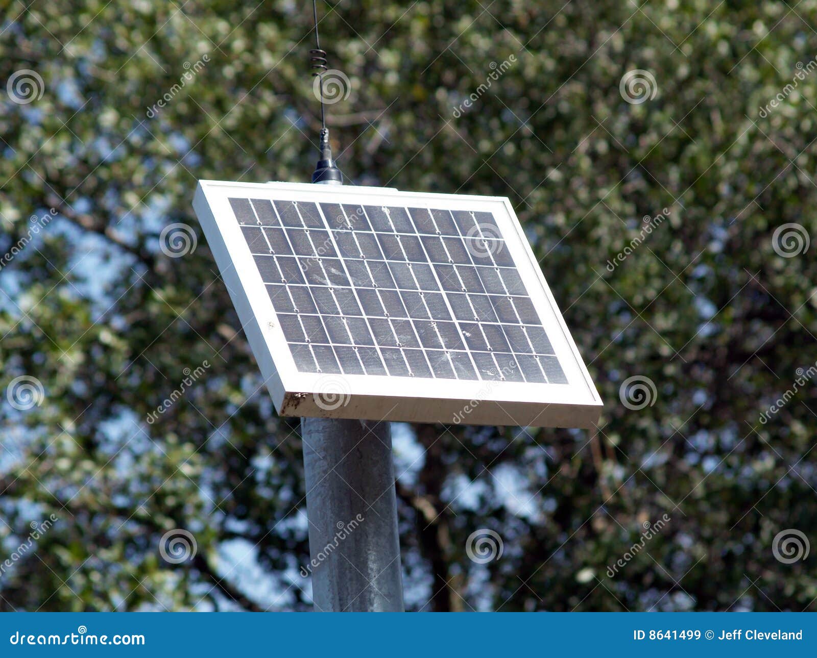 Small Solar Panel on Pole with Trees Stock Image - Image of small ...