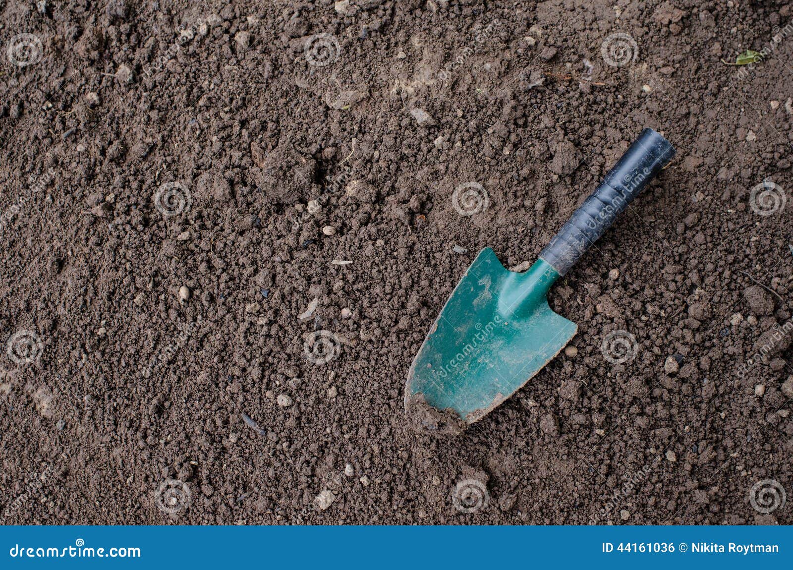 Small spade on garden soil stock photo. Image of fall - 44161036