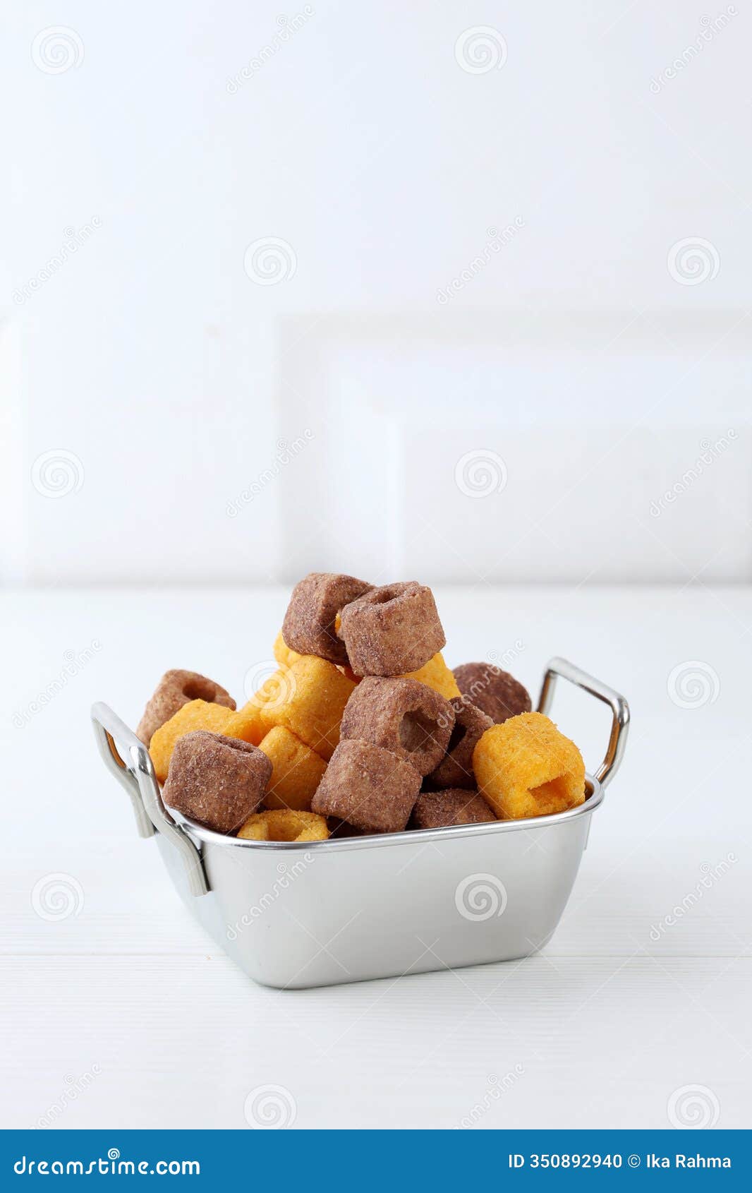 Small Square Cheese and Chocolate Wafer on Stainless Bowl Stock Photo ...