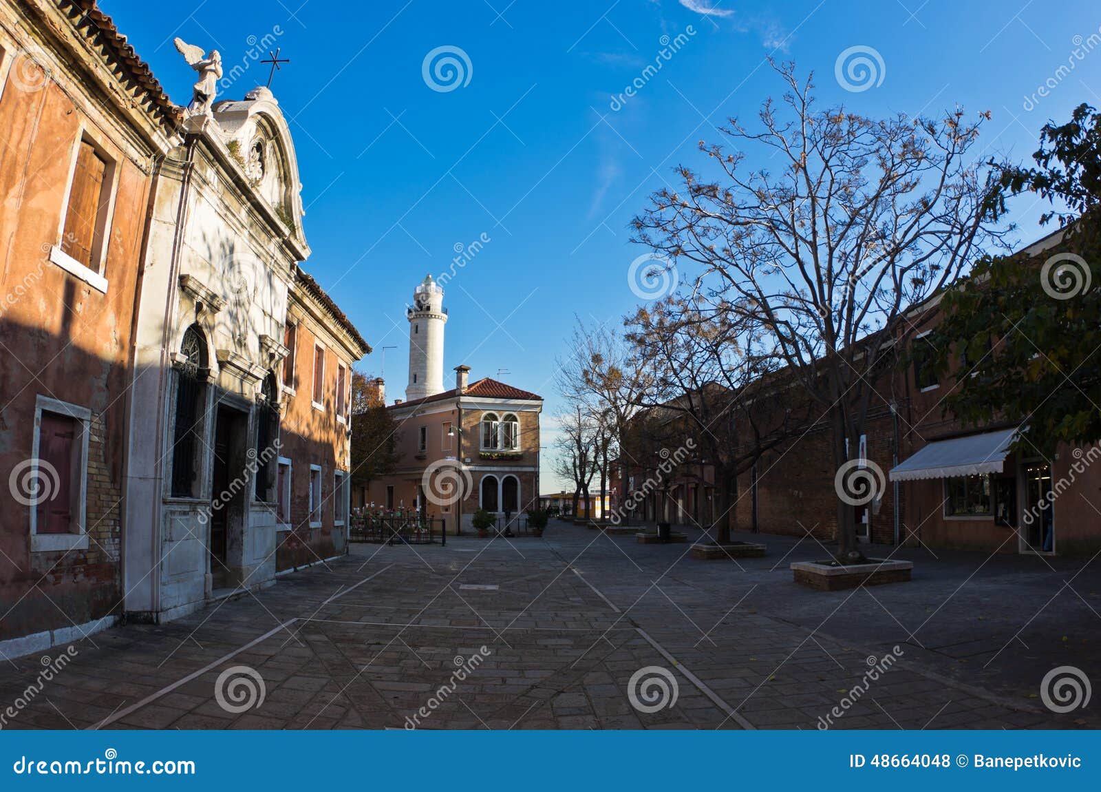 Small Square at Murano Island in Venice, with Lighthouse in Background ...