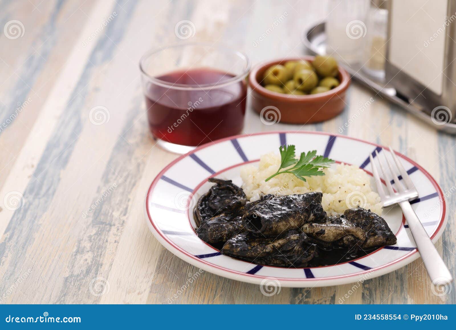 Small Squid Cooked in Black Ink, Spanish Basque Cuisine Stock Photo ...