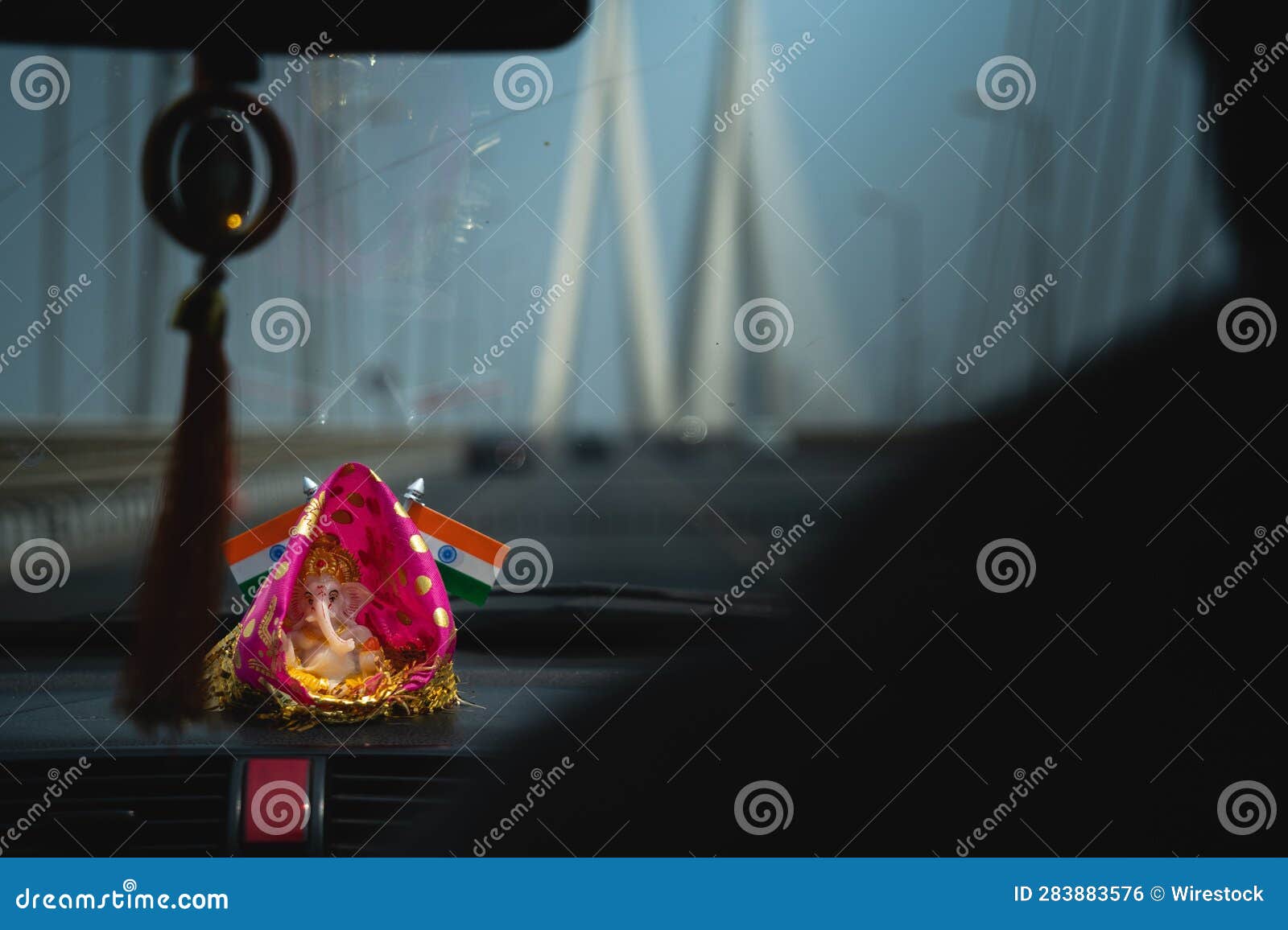 Small Statue of the Hindu God Ganesh on the Dashboard of a Car in India ...