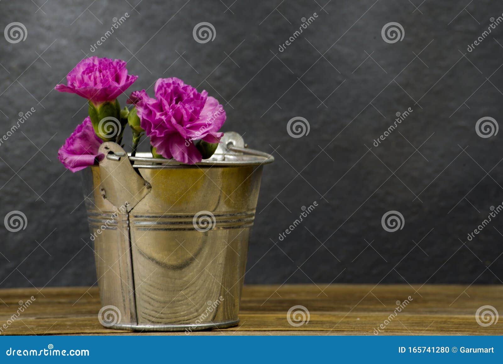 Small Steel Cauldron with Flowers on Wood Stock Photo - Image of ...