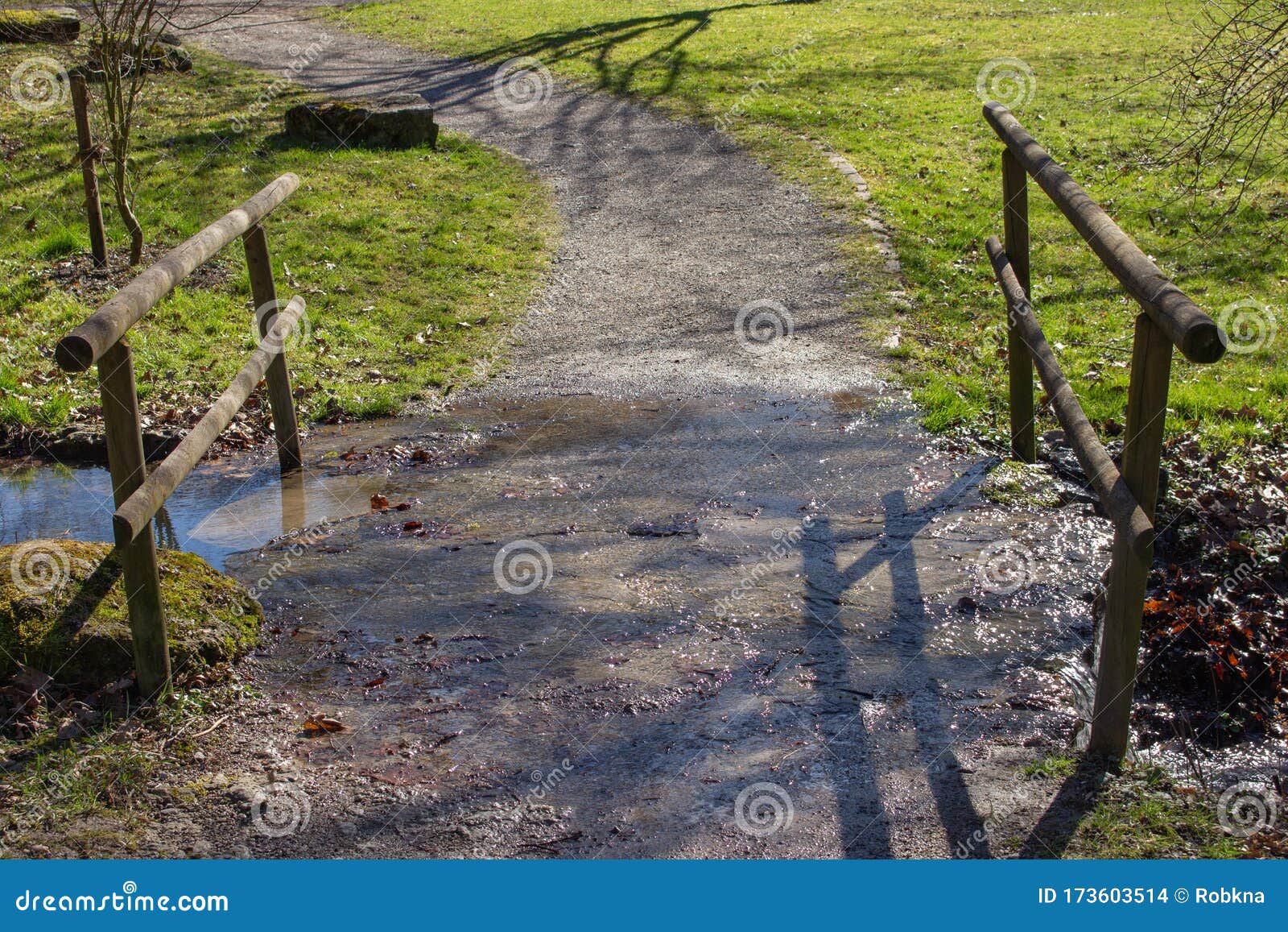 Small Stone Bridge for a Footpath Over a Small Creek Flooded with Water ...
