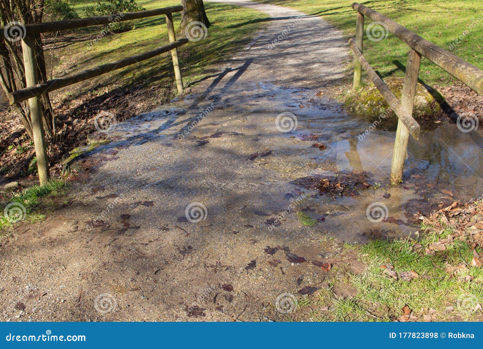 Small Stone Bridge for a Footpath Over a Small Creek Flooded with Water ...