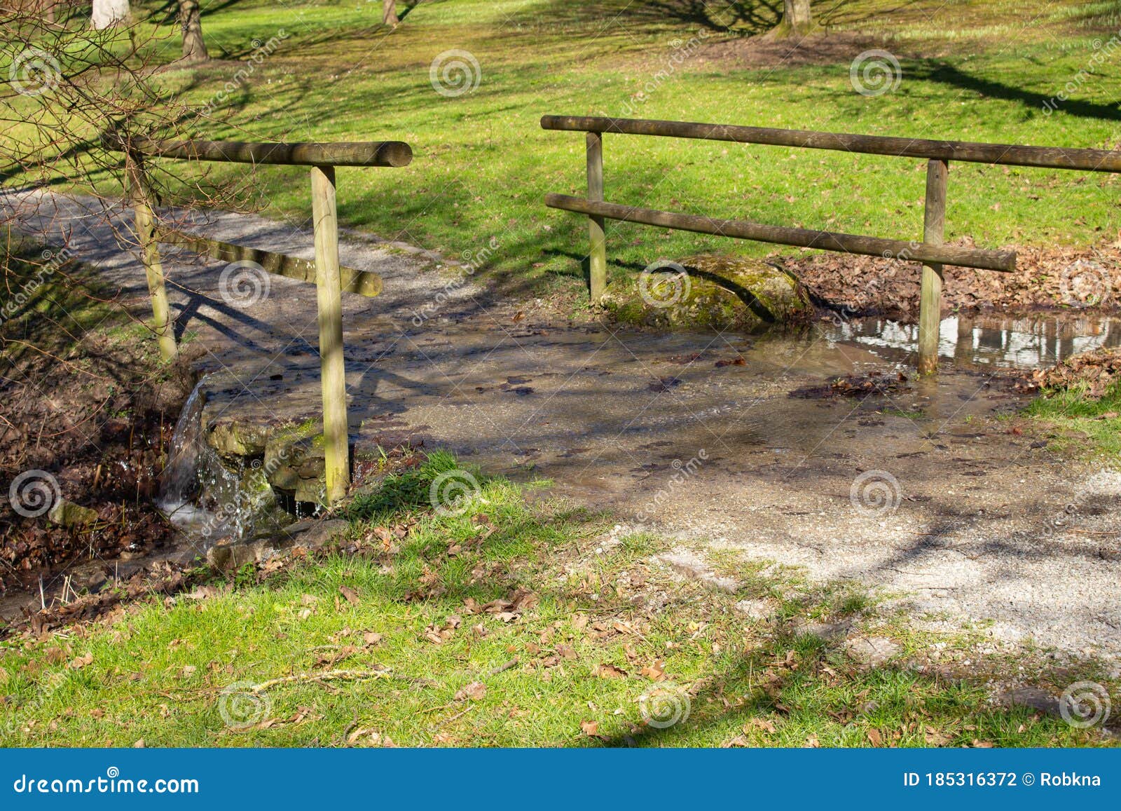 Small Stone Bridge for a Footpath Over a Small Creek Flooded with Water ...