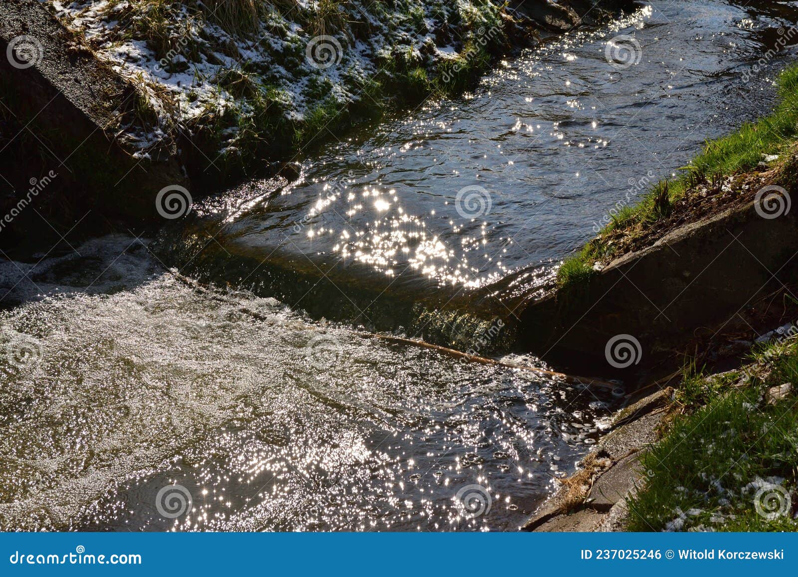 A Small Stream Divided by a Concrete Dam, a Sunny Spring Day Stock ...