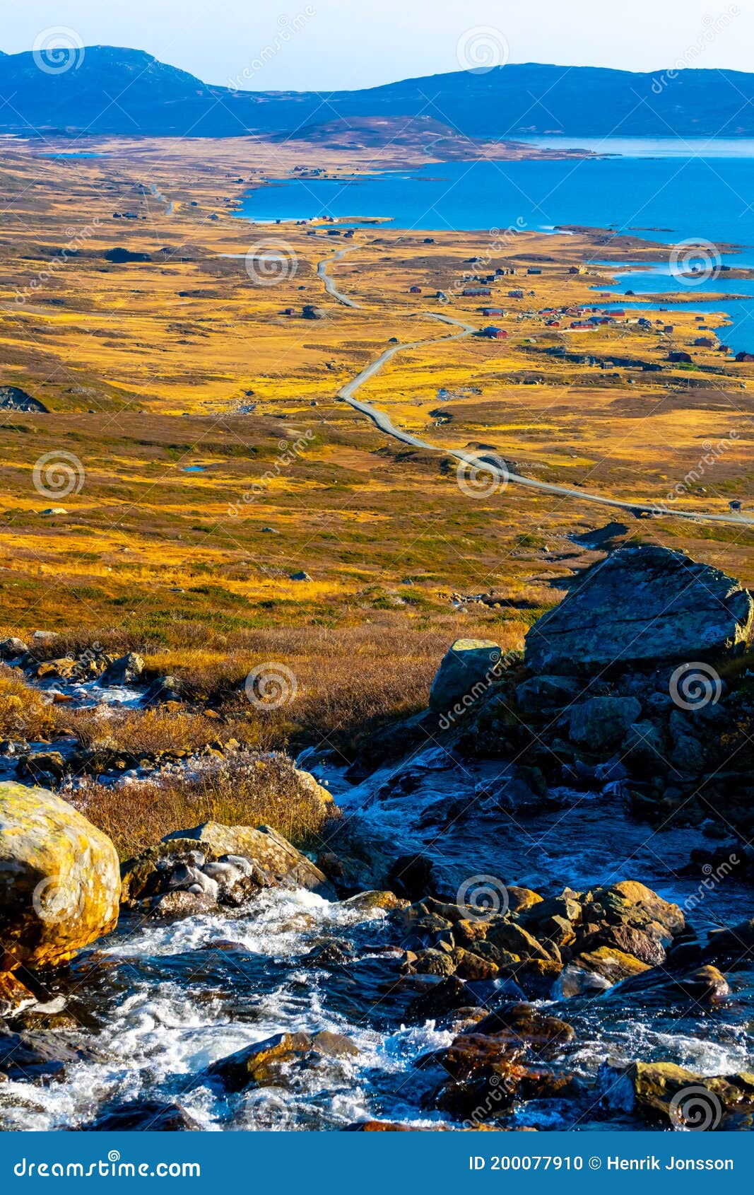 Stream Flowing Down a Mountain with Open Landscape in the Background ...