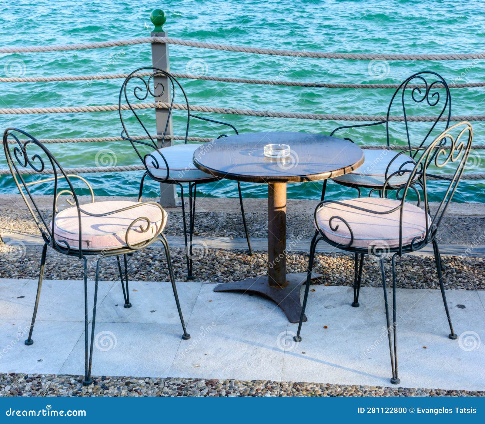 Small Table with Chairs by the Sea Stock Photo - Image of sitting, blue ...