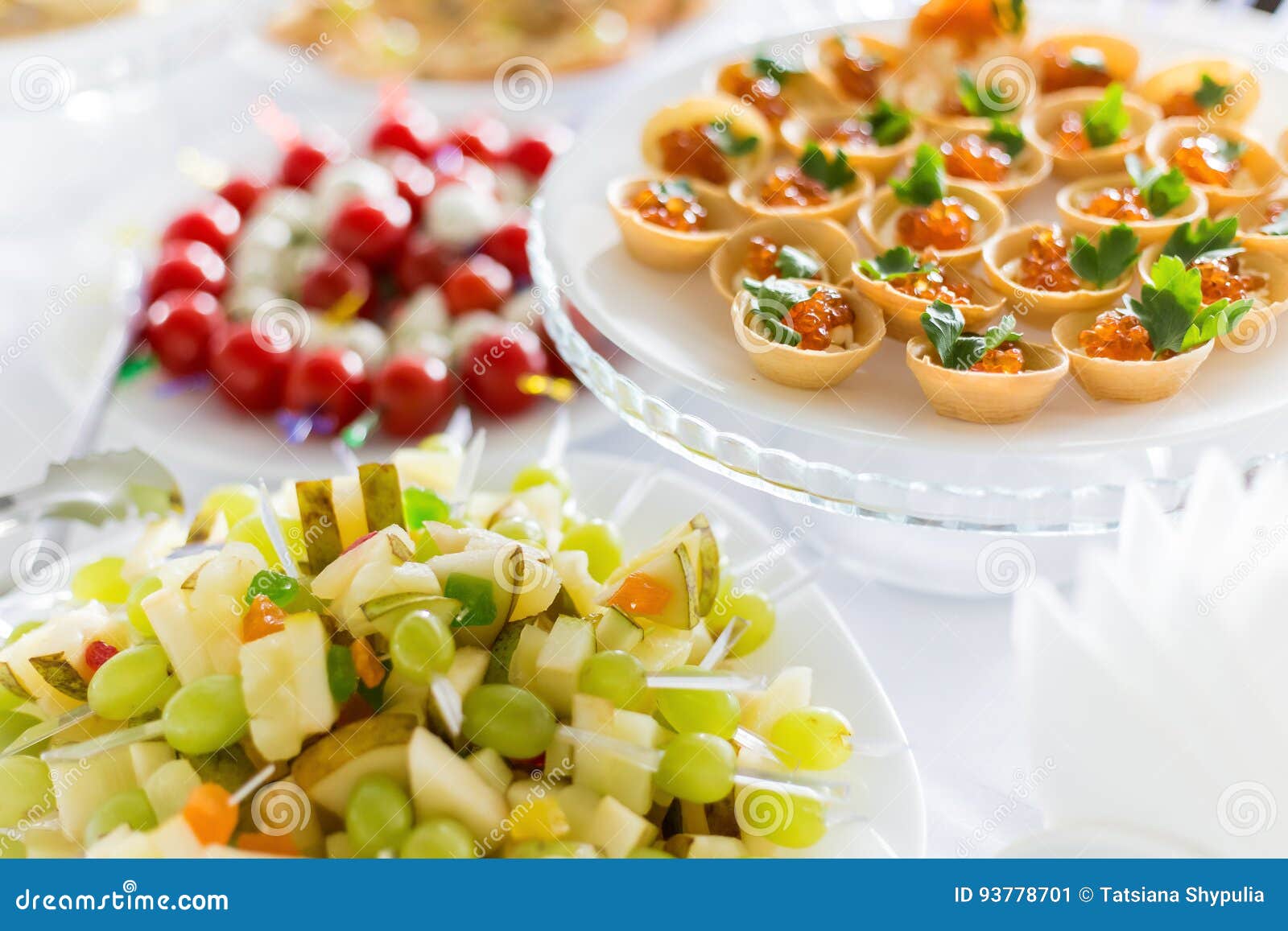 A Small Table with a Delicious Buffet of Canapes, Caviar, Sandwiches ...