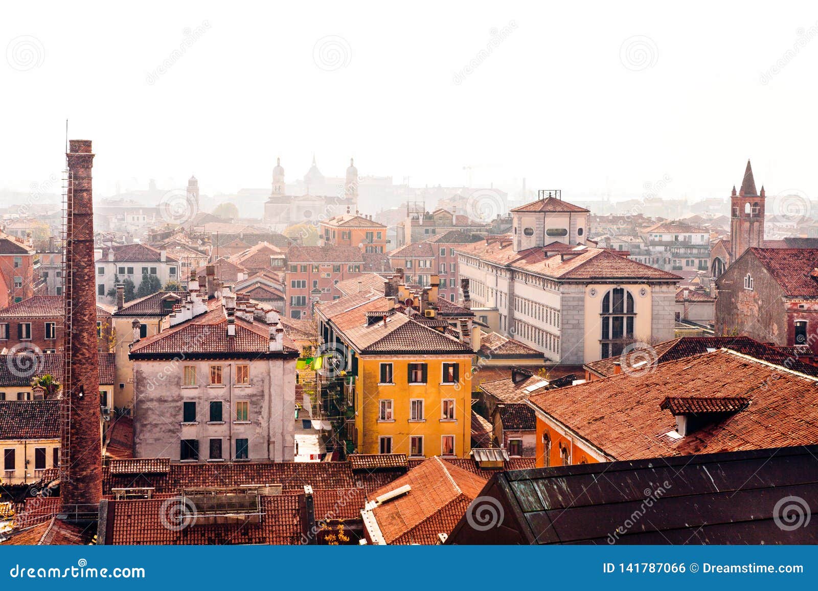 Small town foggy weather stock photo. Image of rooftop - 141787066