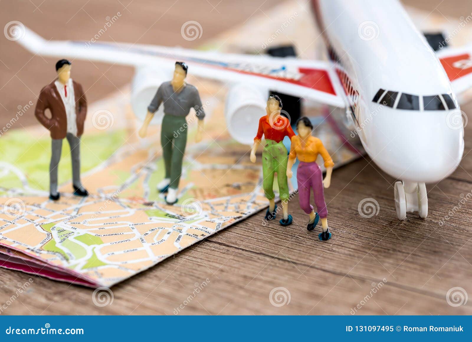 Small Toy People are on the Map in Front of the Plane Stock Image ...