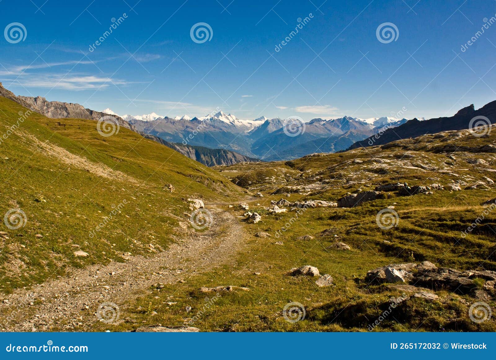 Small Trail Passing through the Mountains with the Snowy Peaks of the ...