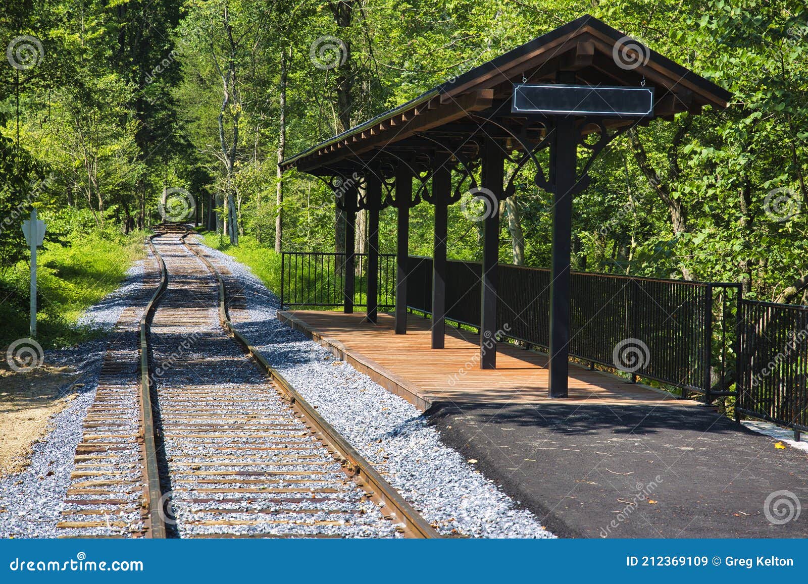 Small Train Station Waiting for Passengers and a Train Stock Image ...