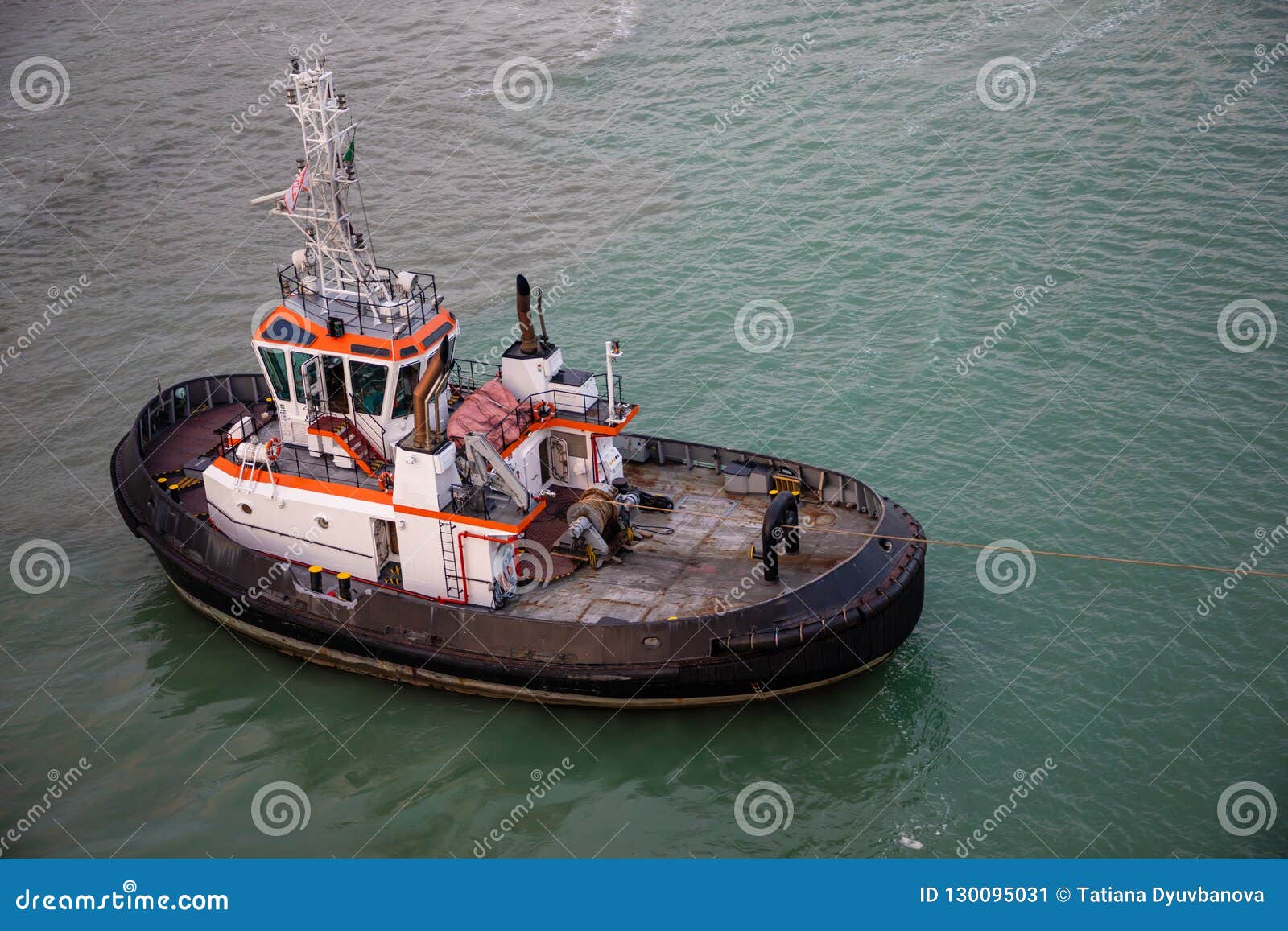 Small Transit Ship Leading Cruise Liner from Venice Stock Image - Image ...