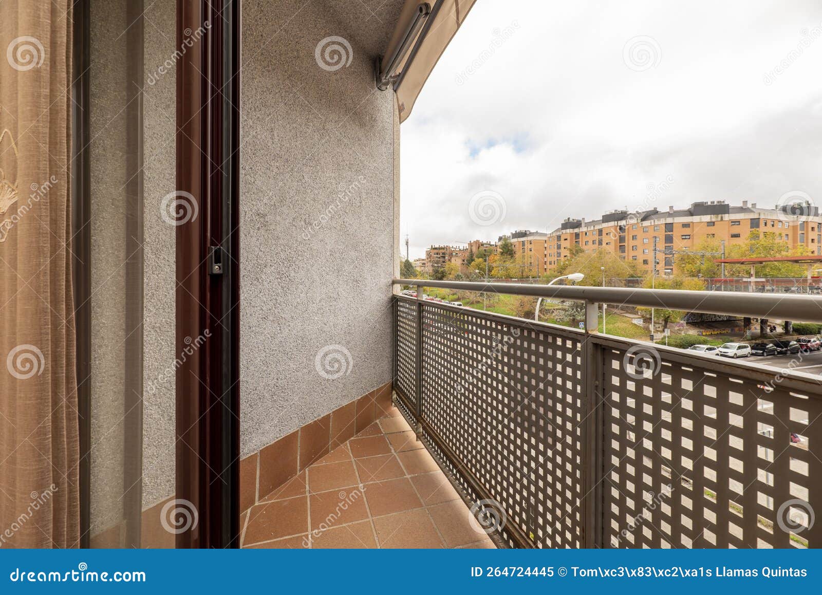 Small Triangular Terrace with Metal Railing and Views of the Park and ...