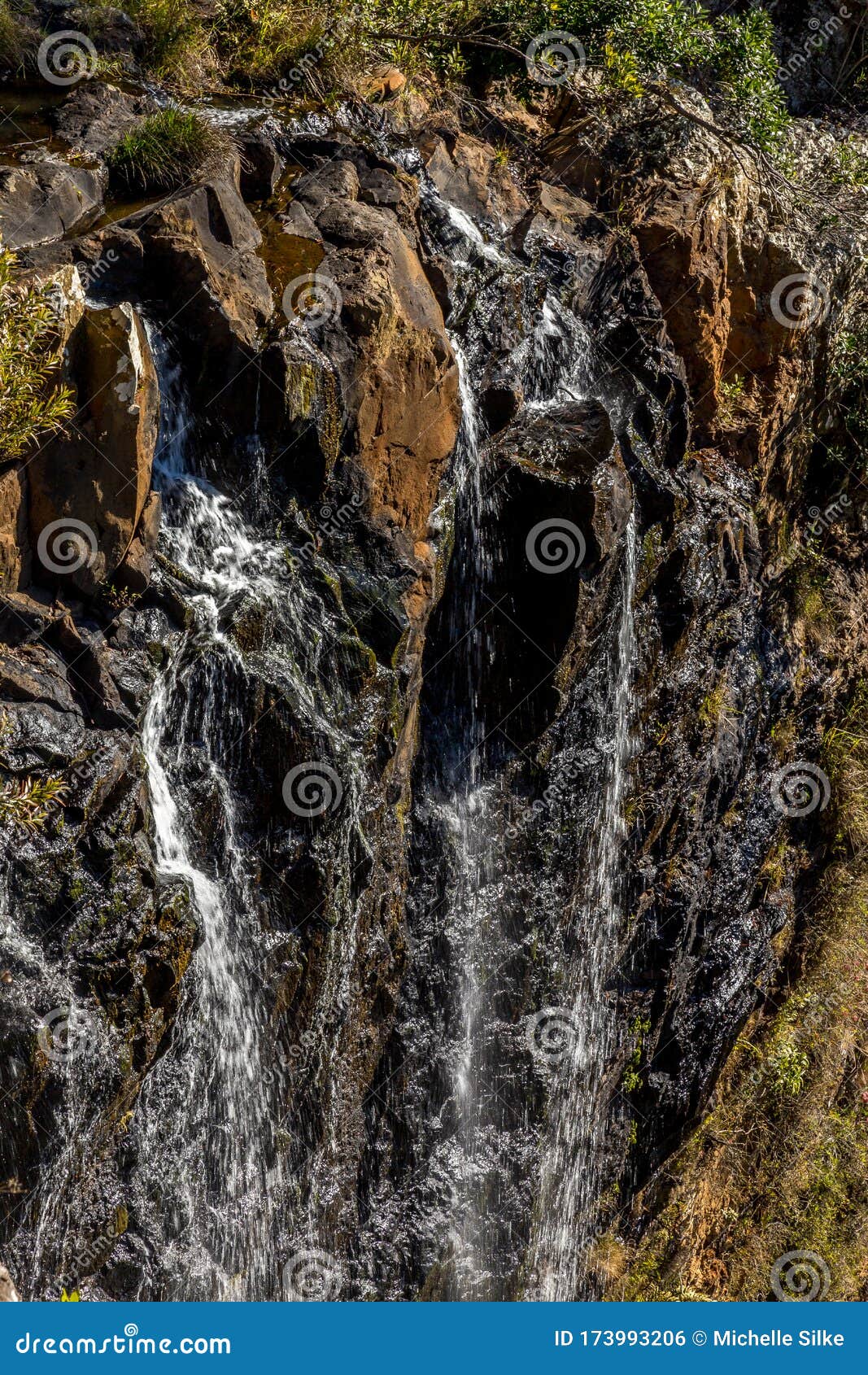 Small Trickle of Water Creates Waterfall Down Rocks Stock Photo - Image ...