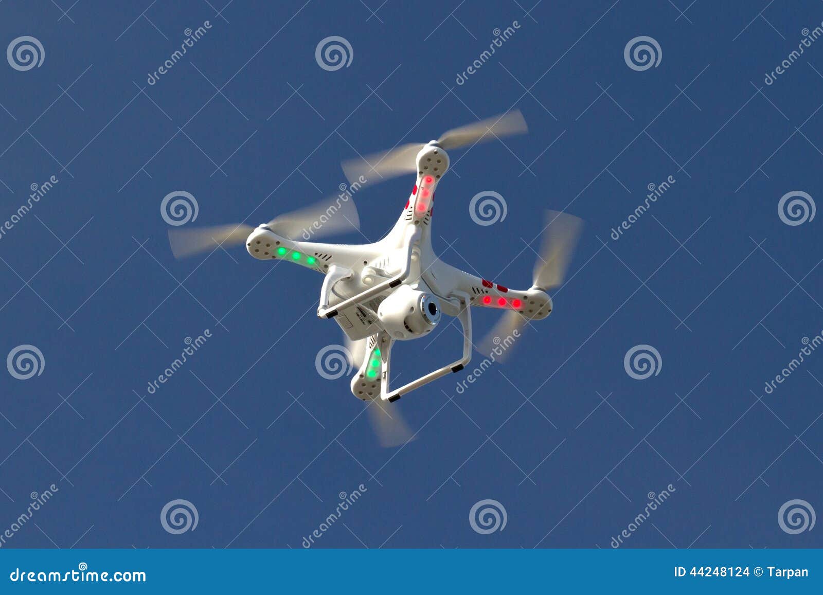 Small Unmanned Helicopter with a Camera Floating in the Sky Stock Photo ...