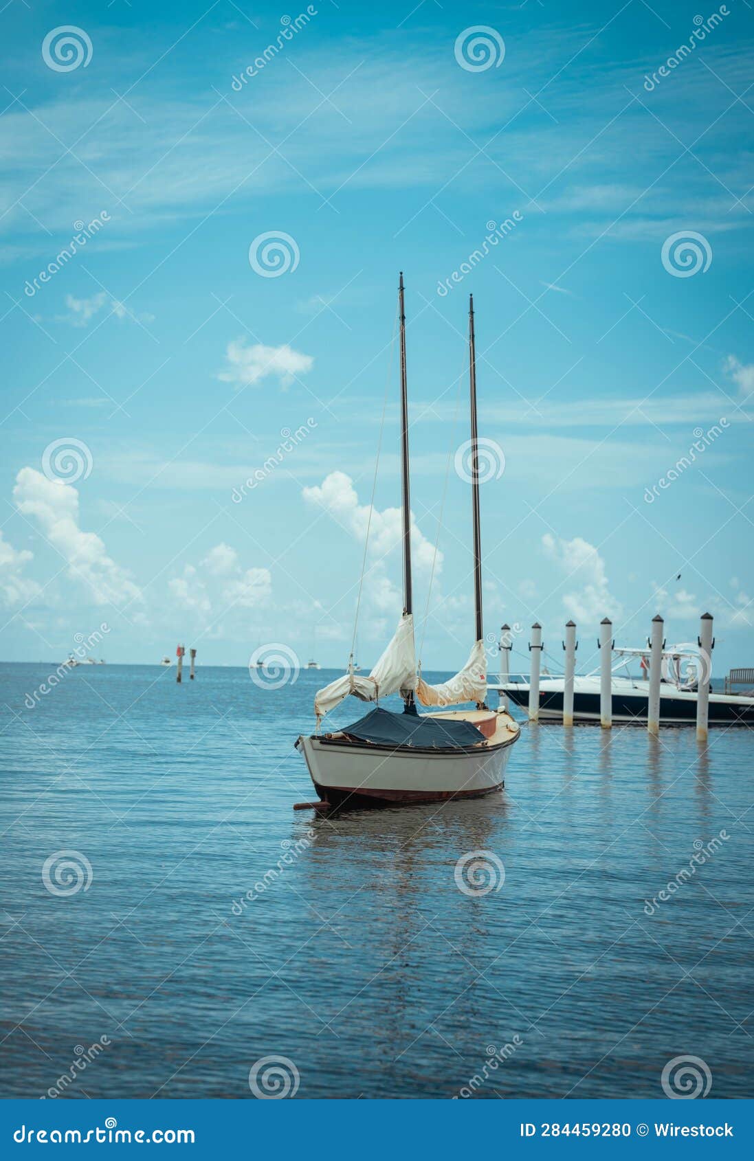 Small Vessel at Dock in Front of a Wooden Pier Stock Photo - Image of ...