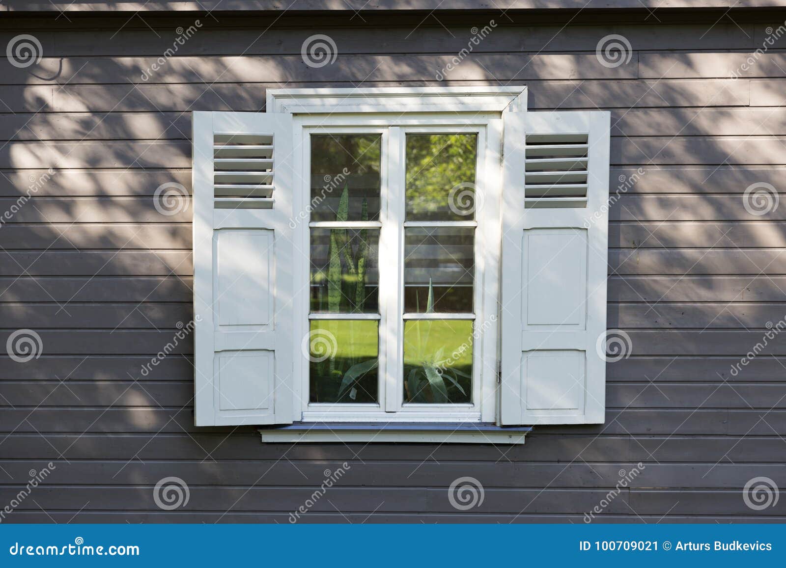 Small Vintage White Window with Shutters on Wooden Grey Wall Stock ...