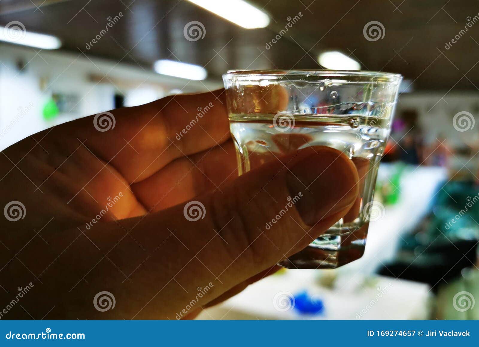 Small vodka in the hand stock image. Image of celebration - 169274657