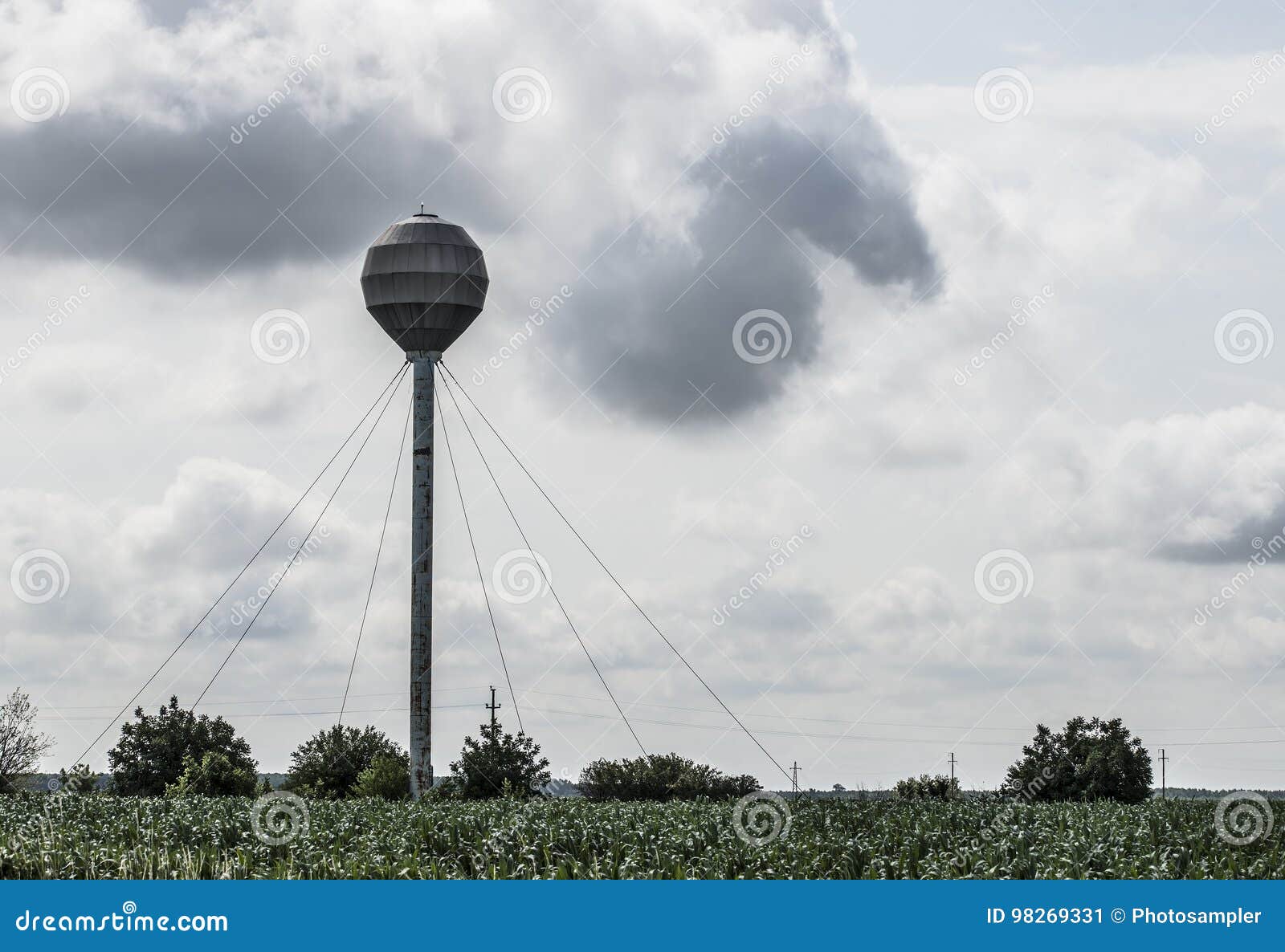 Small Water Tower with Dark Clouds Stock Image - Image of field ...