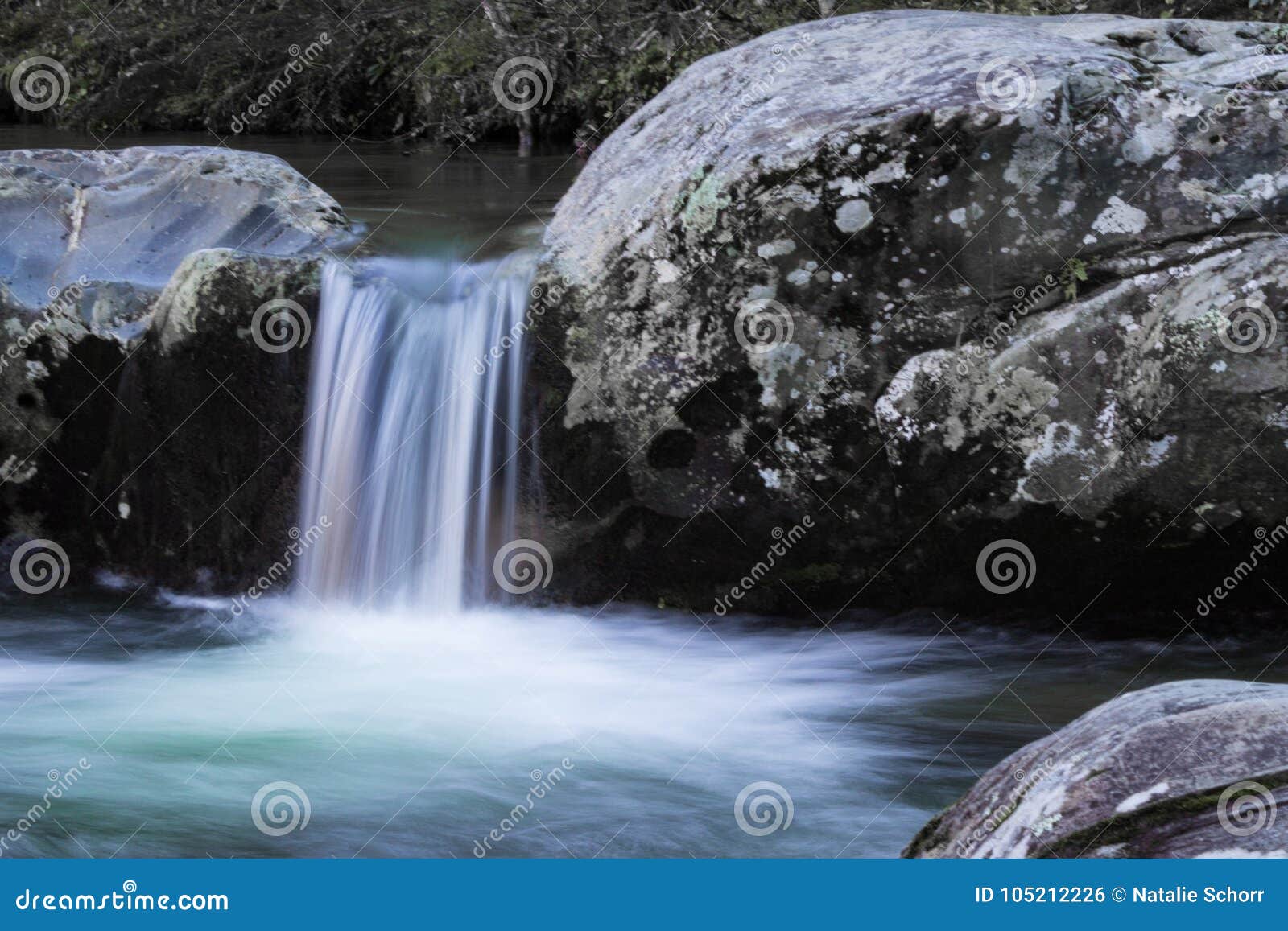 Small Waterfall Cascade between Two Large Rocks Stock Photo - Image of ...