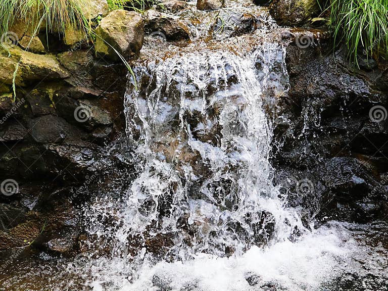 Small Waterfall in Close-up. Falling Water. Waterfall Background. Stock ...