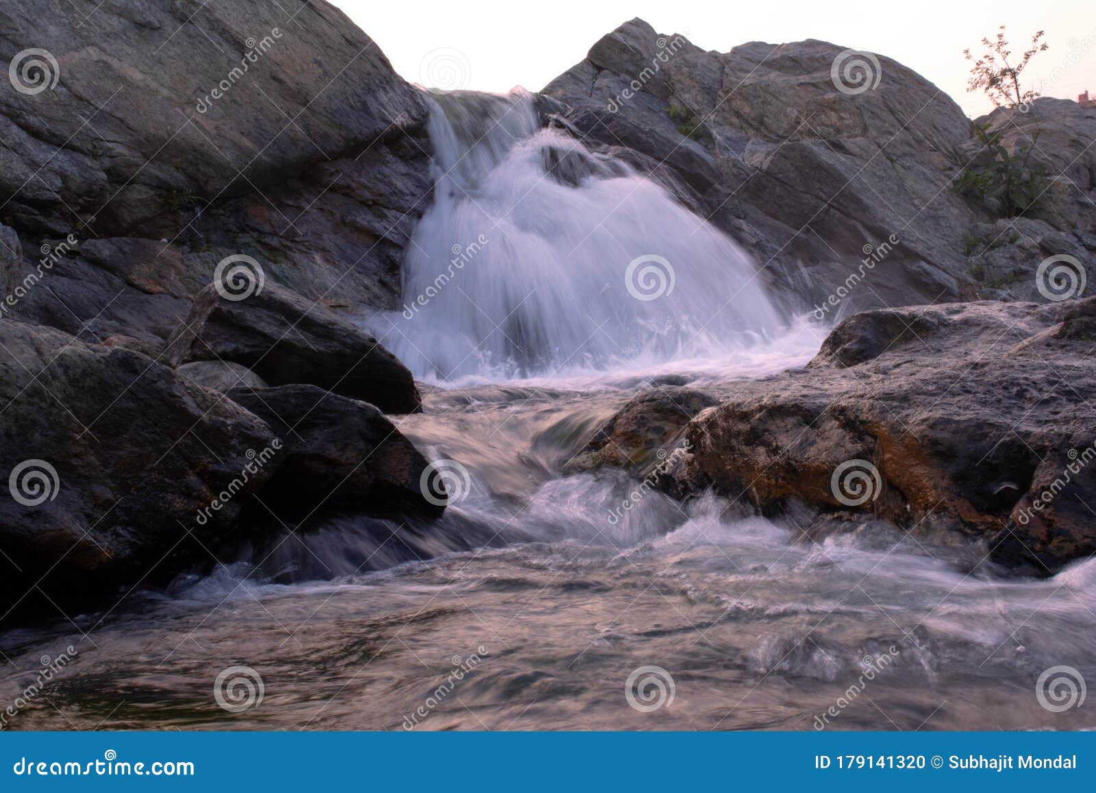 A Small Waterfall Coming Down the Hill Cutting the Rocks Stock Photo ...