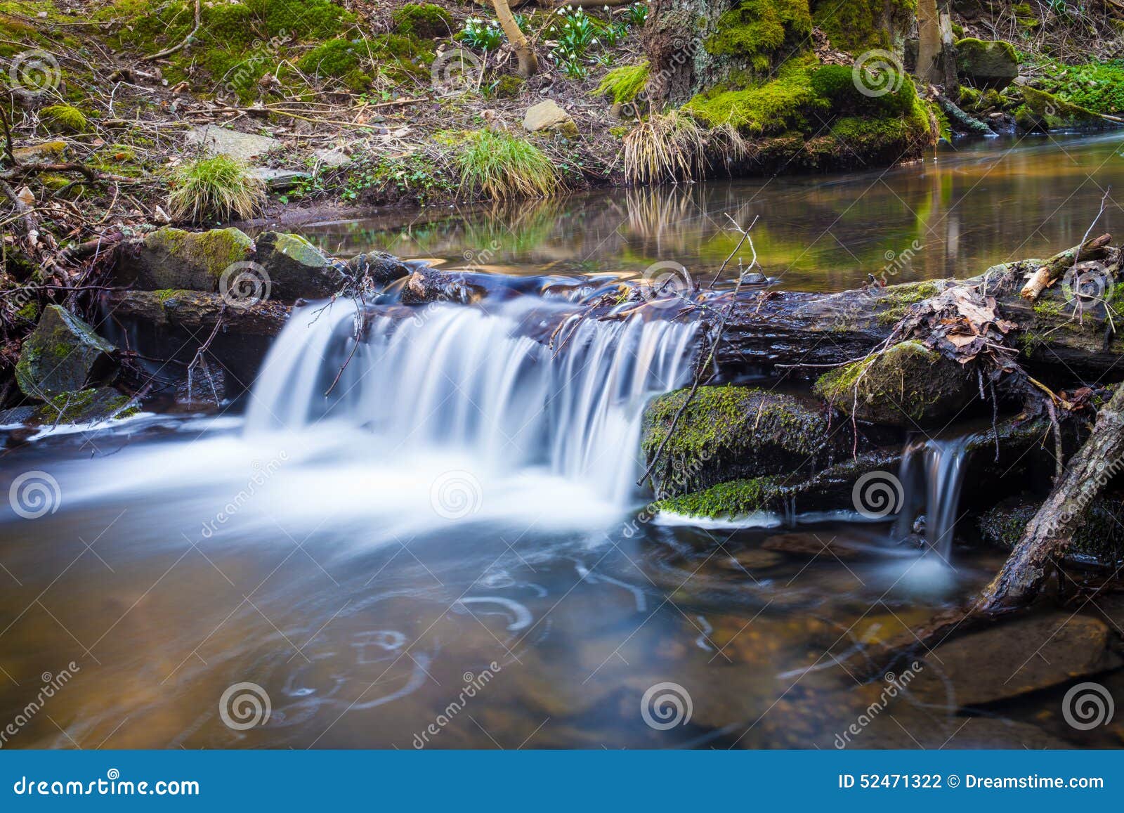Small Waterfall on Creek Flowing Over the Rocks and Wood Stock Photo ...